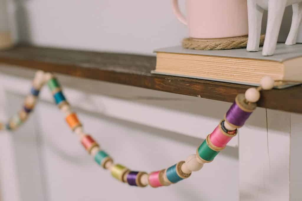 DIY Colorful Garland with Spools of Thread and Wooden Beads