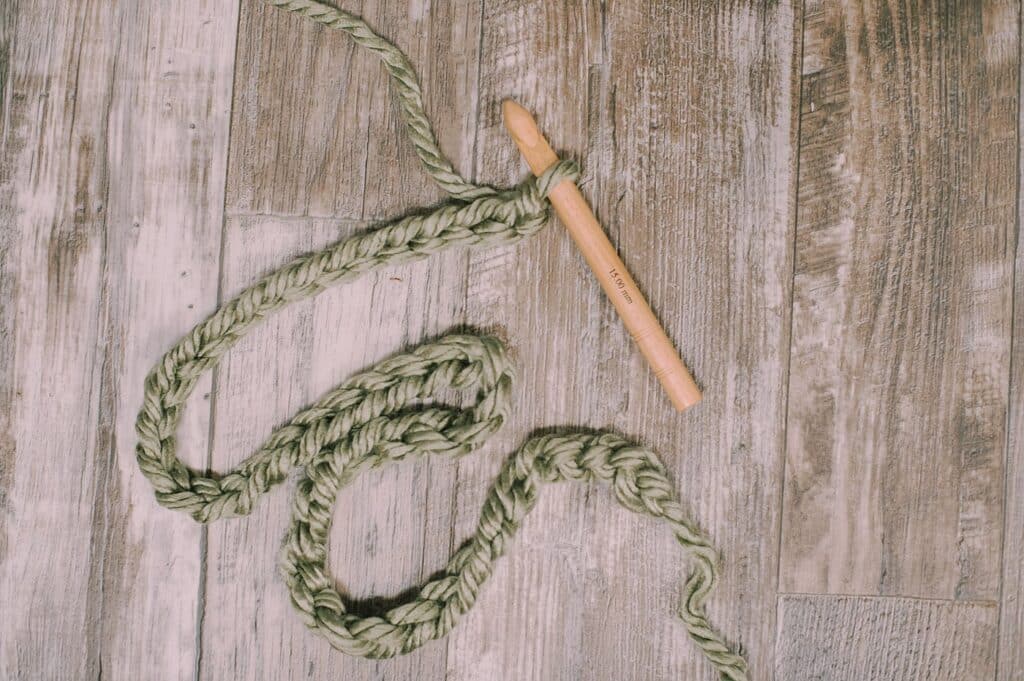 How to Make a DIY Chain Stitch Garland with Chunky Yarn - Laura Radniecki
