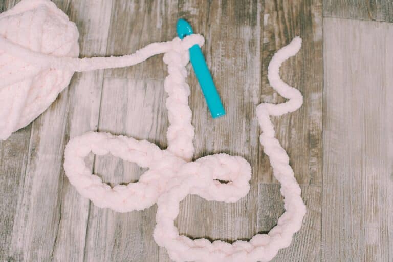 How to Make a DIY Chain Stitch Garland with Chunky Yarn - Laura Radniecki
