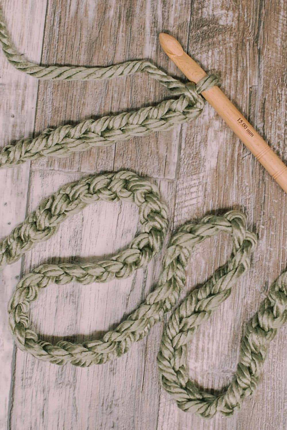 How to Make a DIY Chain Stitch Garland with Chunky Yarn - Laura Radniecki