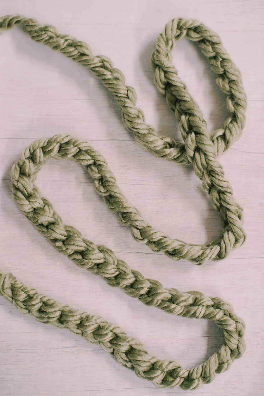 How to Make a DIY Chain Stitch Garland with Chunky Yarn - Laura Radniecki