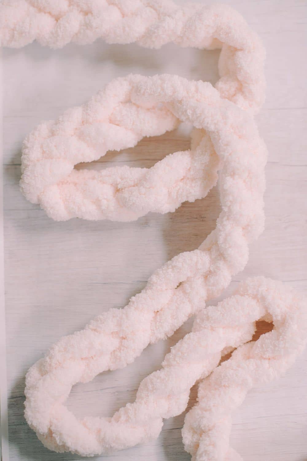 How to Make a DIY Chain Stitch Garland with Chunky Yarn - Laura Radniecki